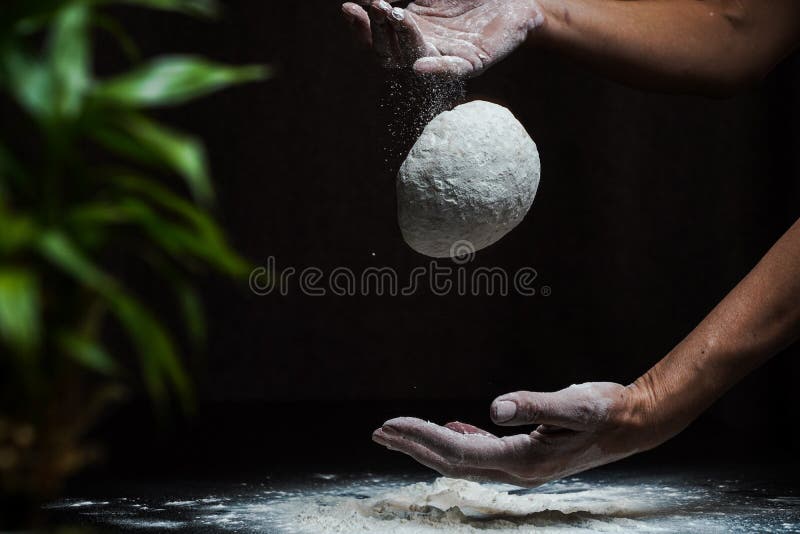 Flour Falling on a Dark Table. Preparing the Homemade Bread Making ...