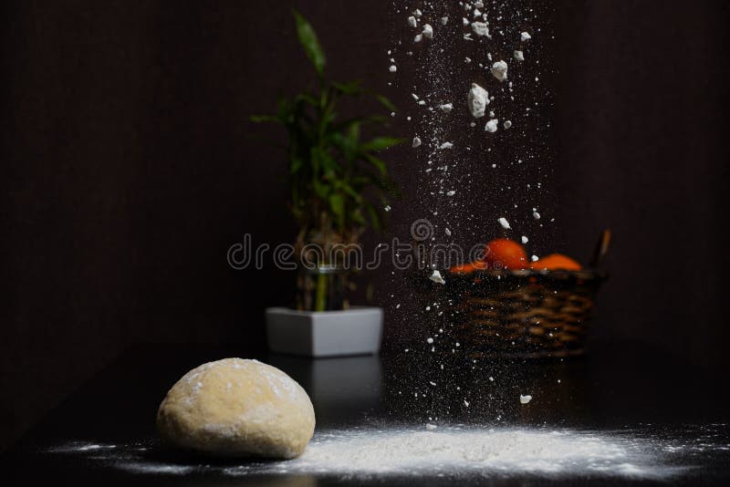 Flour Falling on a Dark Table. Preparing the Homemade Bread Making ...