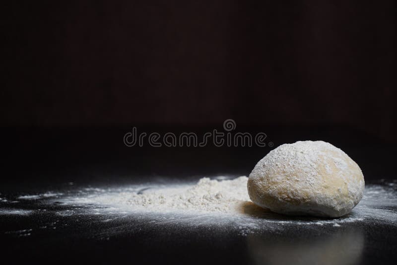Flour Falling on a Dark Table. Preparing the Homemade Bread Making ...