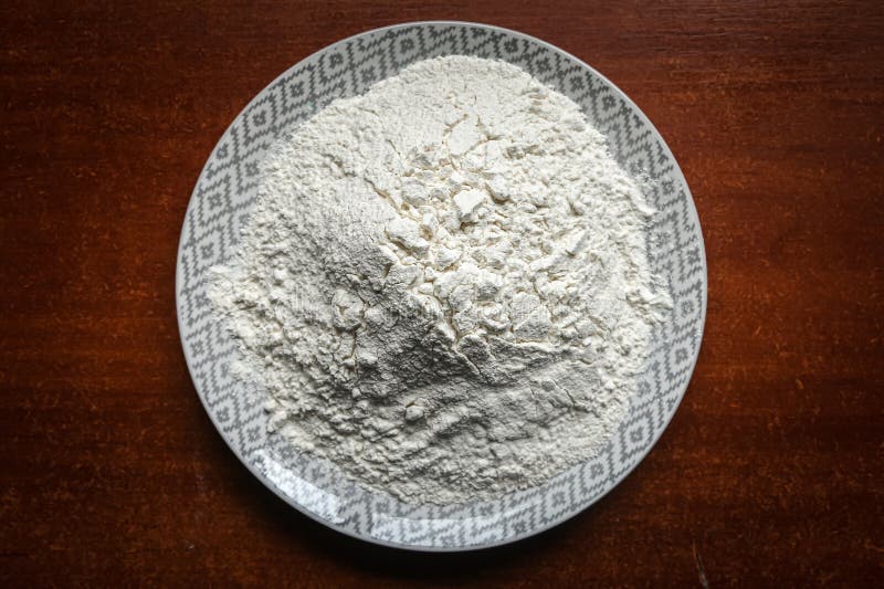 Flour on a Plate on a Dark Background Stock Photo - Image of flour ...