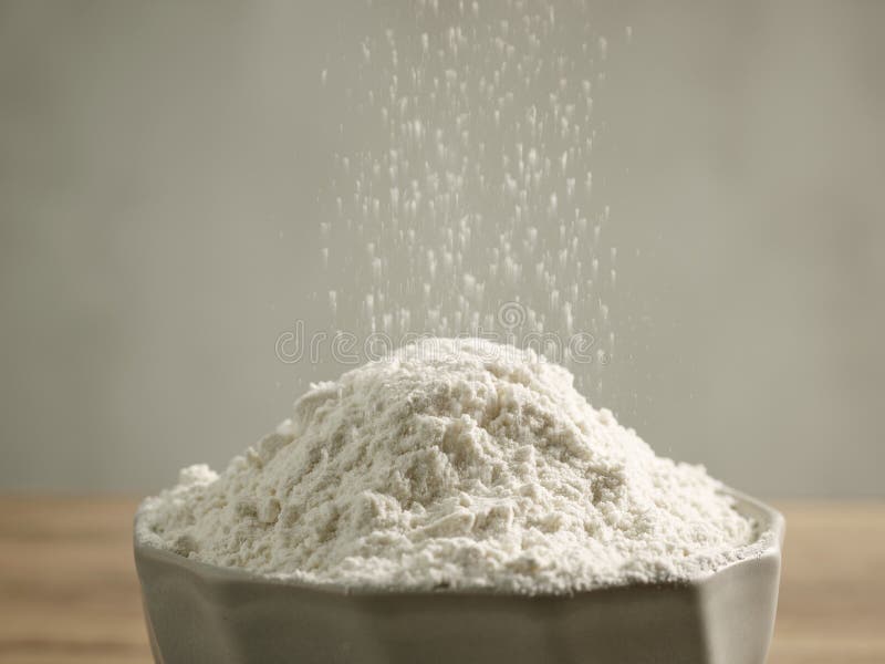 Flour pouring into bowl stock photo. Image of cuisine - 255564534