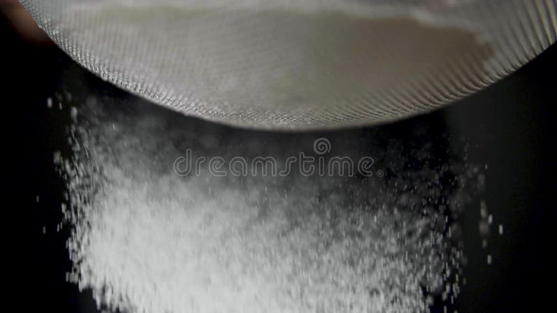 Flour is Sifted through a Sieve on Black Background Stock Video - Video ...