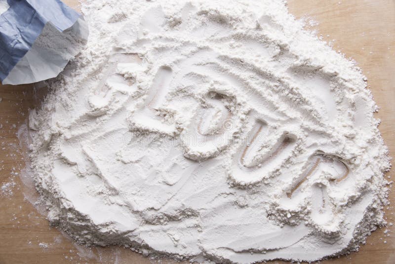Flour written with flour stock image. Image of preparation - 85989359