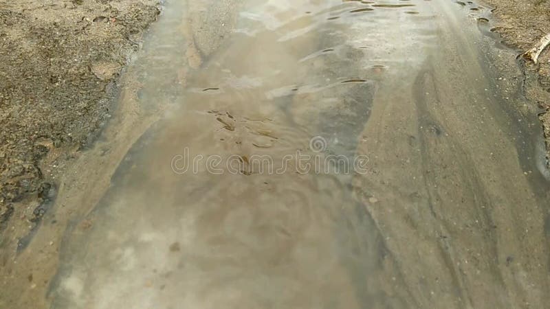 Flow of a Dirty Melted Puddle in Spring. Stock Footage - Video of ...
