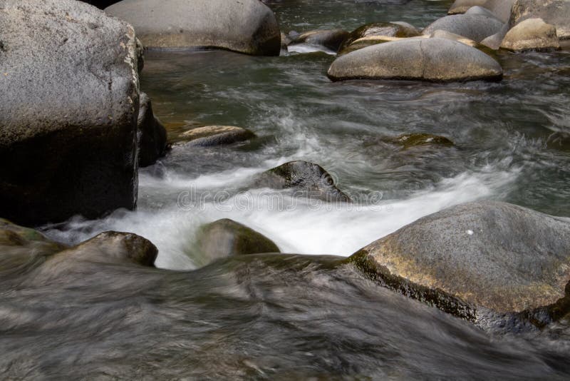 The Flow of River Water Flowing through the Rocks Stock Image - Image ...