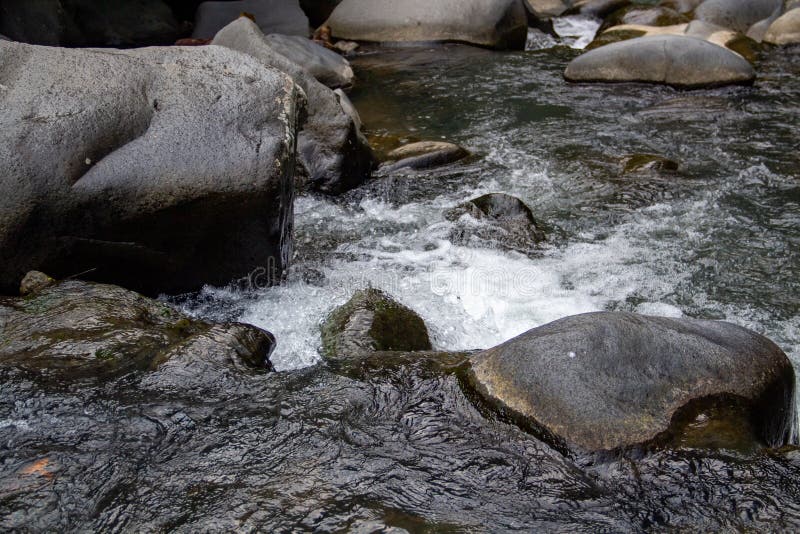 The Flow of River Water Flowing through the Rocks Stock Image - Image ...