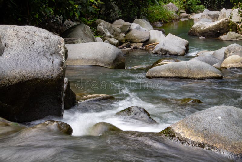 The Flow of River Water Flowing through the Rocks Stock Image - Image ...