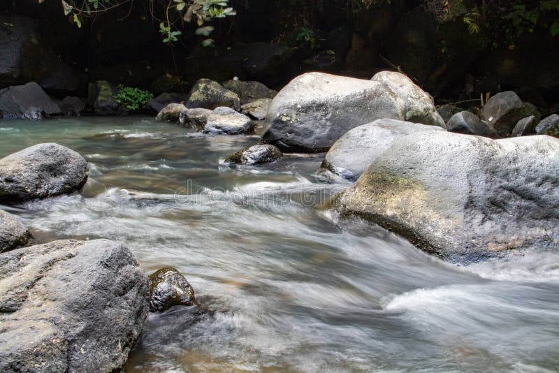 The Flow of River Water Flowing through the Rocks Stock Photo - Image ...