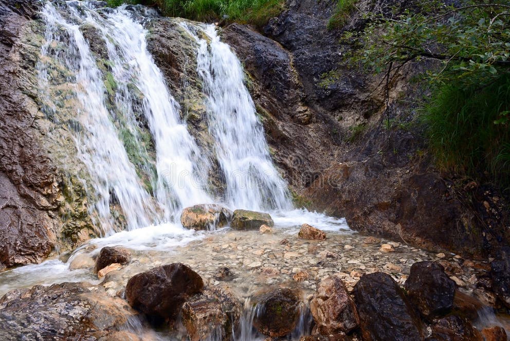 The Flow of a Small Waterfall on the Rock Flows Over the Stones. Long ...