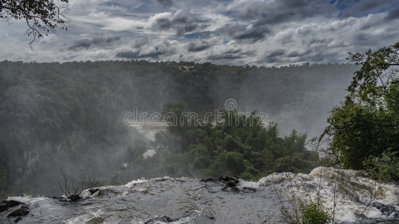 The Flow of Water Breaks from the Edge of the Ledge into the Abyss ...