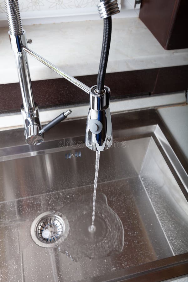 Flow of Water in a Metal Sink on a Modern Kitchen Stock Photo - Image ...