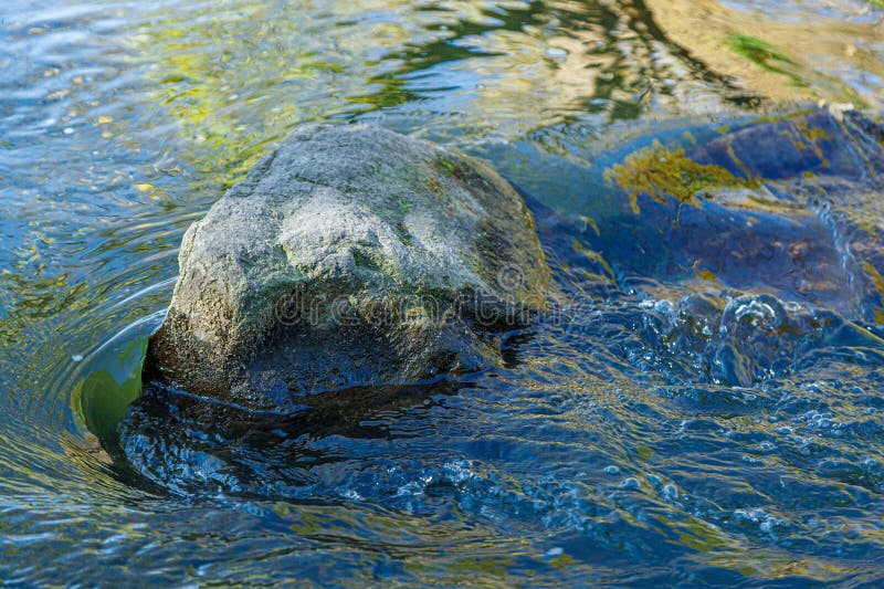 Flow of Water and Spray from a Stone Stock Photo - Image of flowing ...