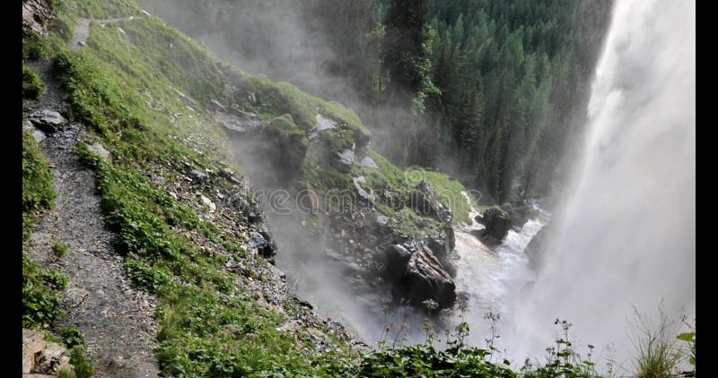 Flow of Water from the Waterfall Falls on Rocks and Boulders from Top ...