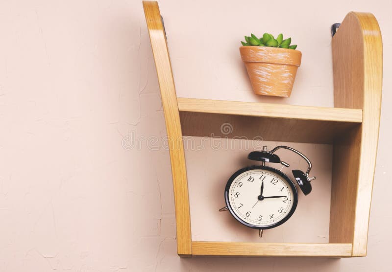 Flower Alarm Clock Jumping on a Wooden Shelf. Stock Photo - Image of ...