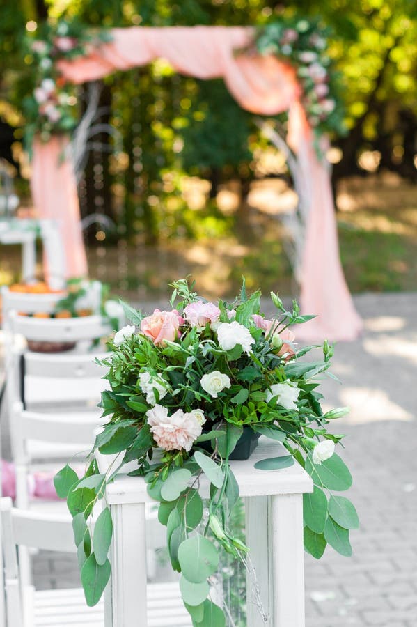 Flower Arrangement Against the Backdrop of a Wedding Arch Stock Photo ...