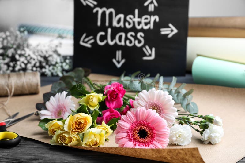 Flower Arrangement Master Class. Paper Wrapping with Flowers on Table ...