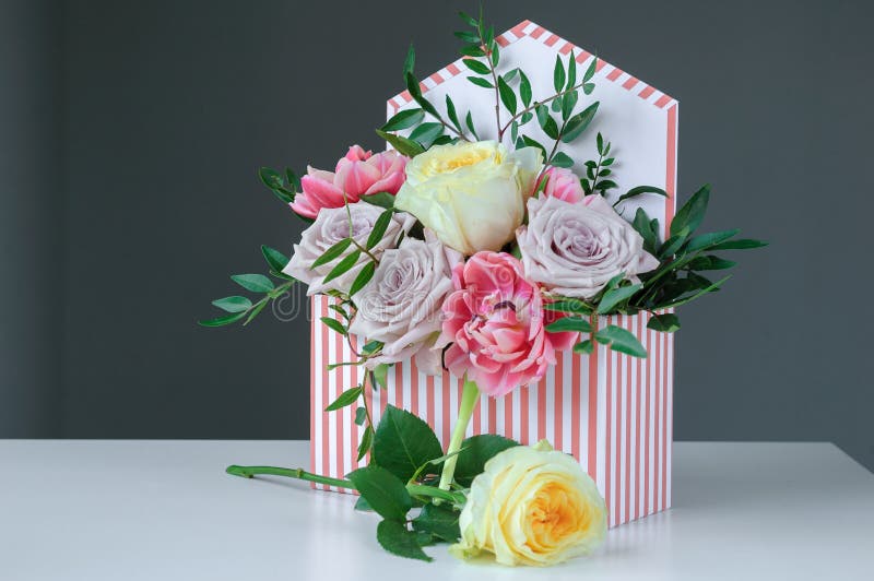 Flower Arrangement of Multicolored Roses in a Cardboard Gift Box Stock ...