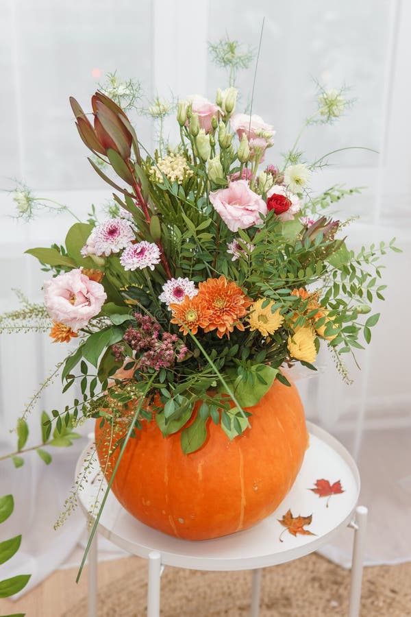 Flower Arrangement in a Pumpkin, Autumn Interior Decor. Creating ...