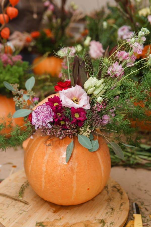 Flower Arrangement in a Pumpkin, Autumn Interior Decor. Creating ...