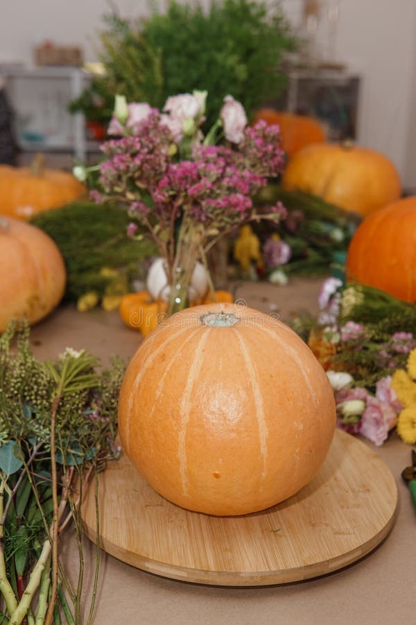 Flower Arrangement in a Pumpkin, Autumn Interior Decor. Creating ...