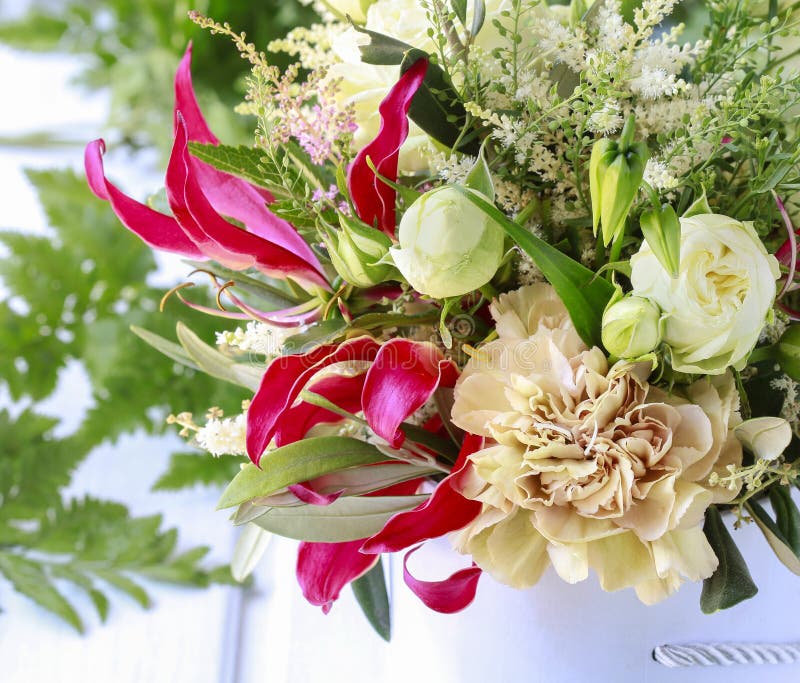 Flower Background with Gloriosa, Carnations and Roses Stock Photo ...