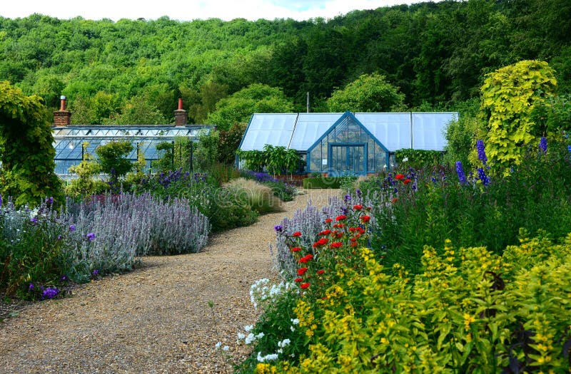 Flower Borders in Bloom and Greenhouse Stock Image - Image of ...