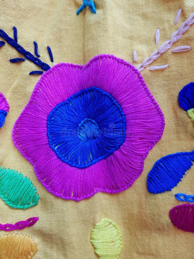 Flower Figure Embroidered with Color Threads on Yellow Fabric Stock ...