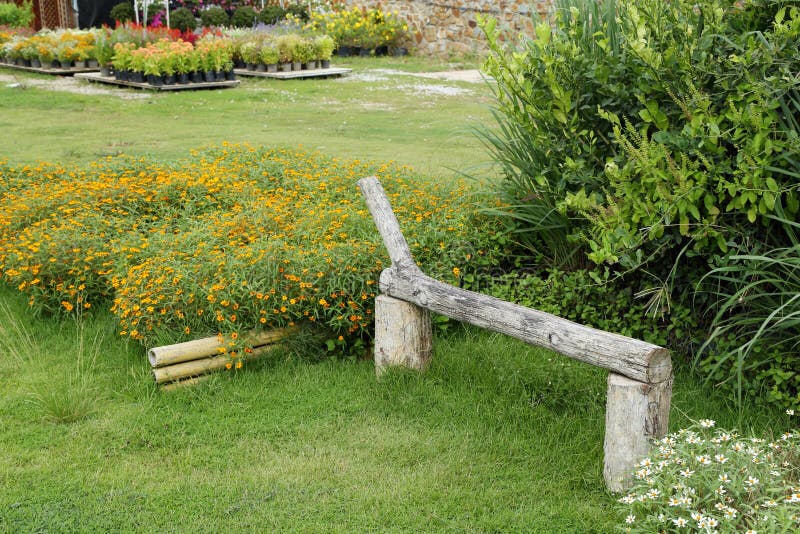 Flower garden with bench stock photo. Image of chair - 43821960