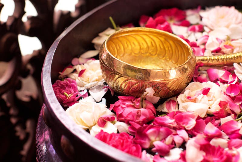 Flower Petals in Water with Golden Scoop Stock Image - Image of ...