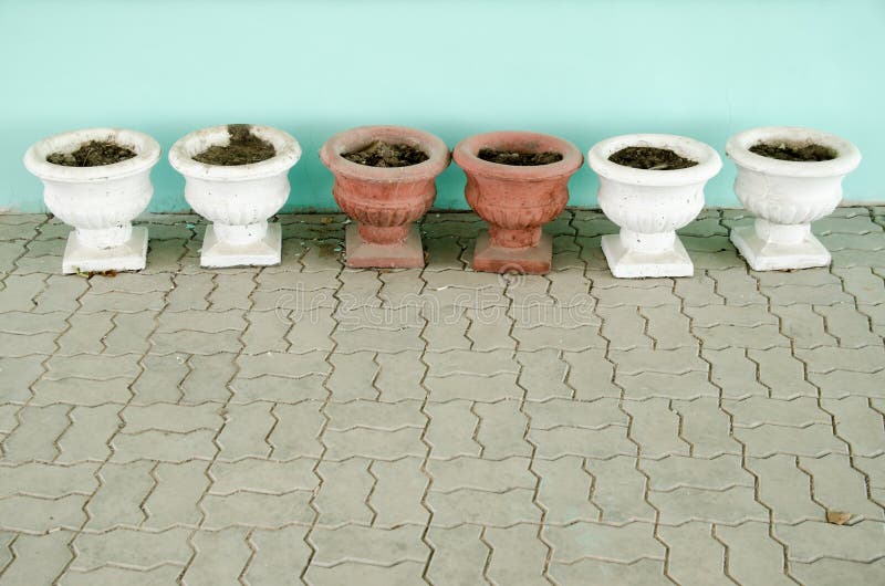 Flower Pots Arranged in a Row Near the Wall of a House Stock Image ...