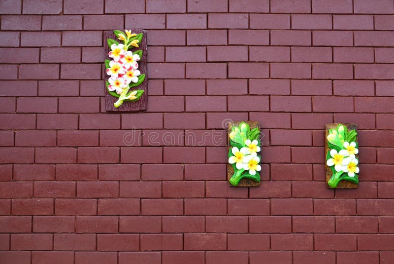 Flower Sculpture on Brick Wall Stock Photo - Image of texture ...