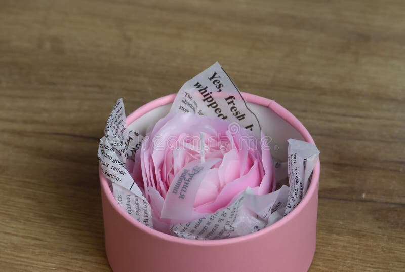 A Flower-shaped Candle in a Mini Box. Gift Packaging Stock Photo ...