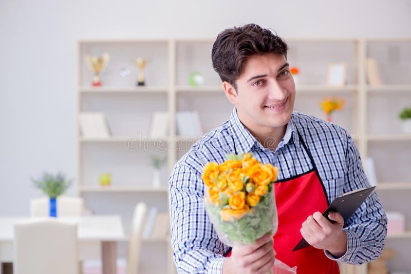 The Flower Shop Assistant Offering a Bunch of Flowers Stock Image ...