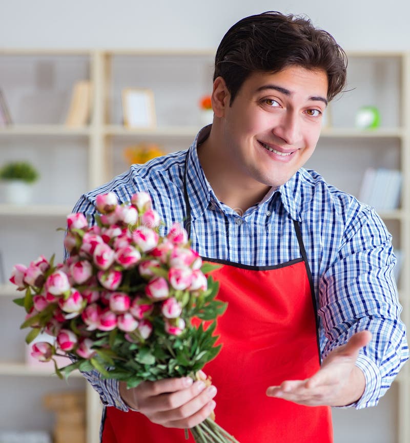 The Flower Shop Assistant Offering a Bunch of Flowers Stock Image ...