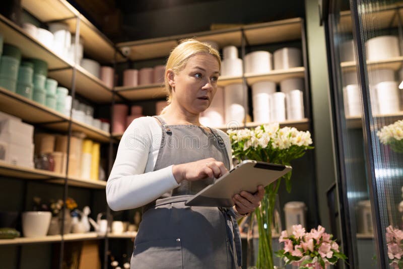 Flower Shop Employee Doing Inventory in Warehouse Stock Photo - Image ...