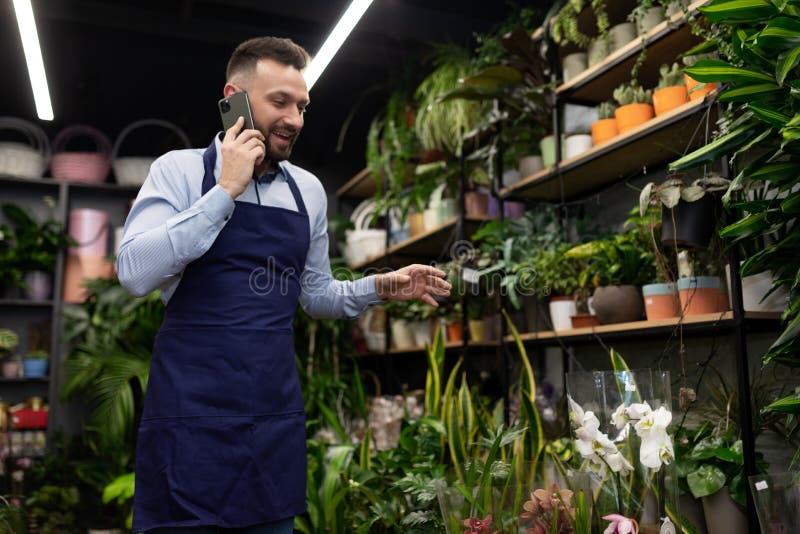 Flower Shop Employee Talking on the Phone Stock Image - Image of summer ...
