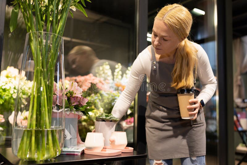 Flower Shop Employee in Work Process Next To a Refrigerator with ...