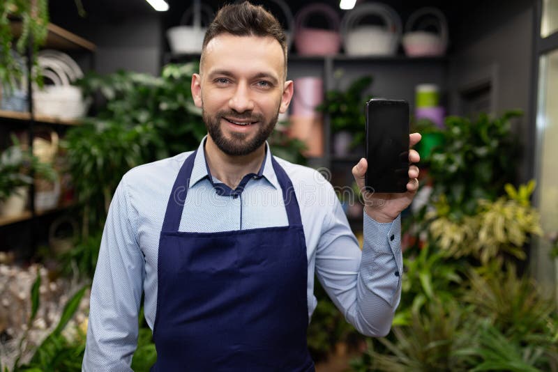 Flower Shop Manager Showing Smartphone Screen Stock Photo - Image of ...