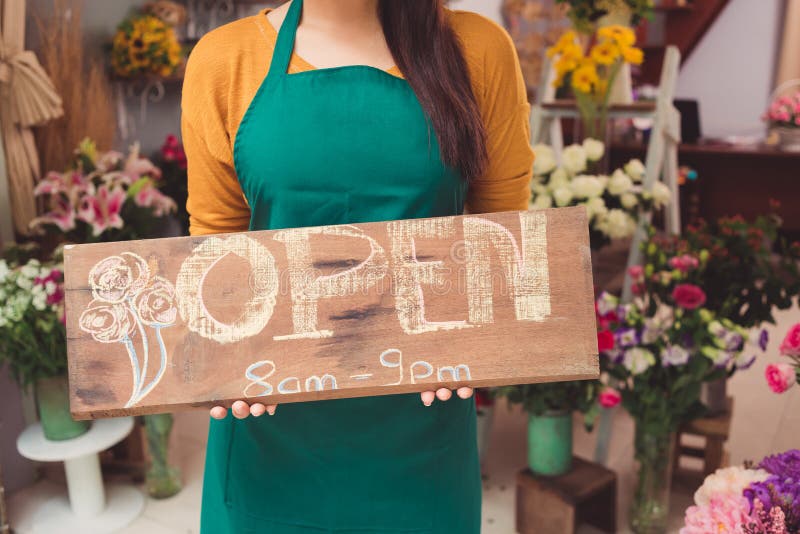 Flower shop is open stock image. Image of apron, assistant - 46499765