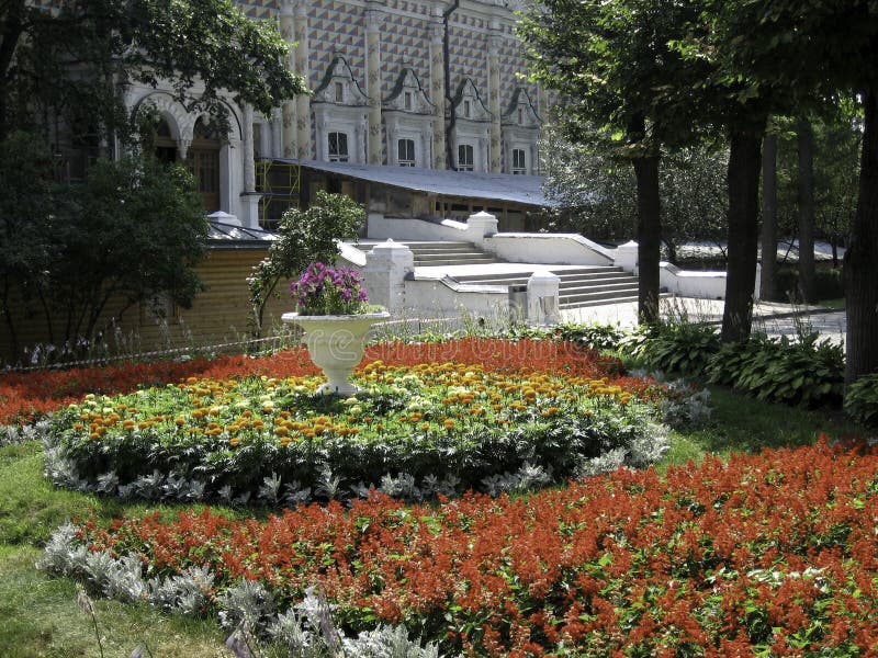 Flowerbed of Different Flowers with a Pot in the Park Stock Image ...