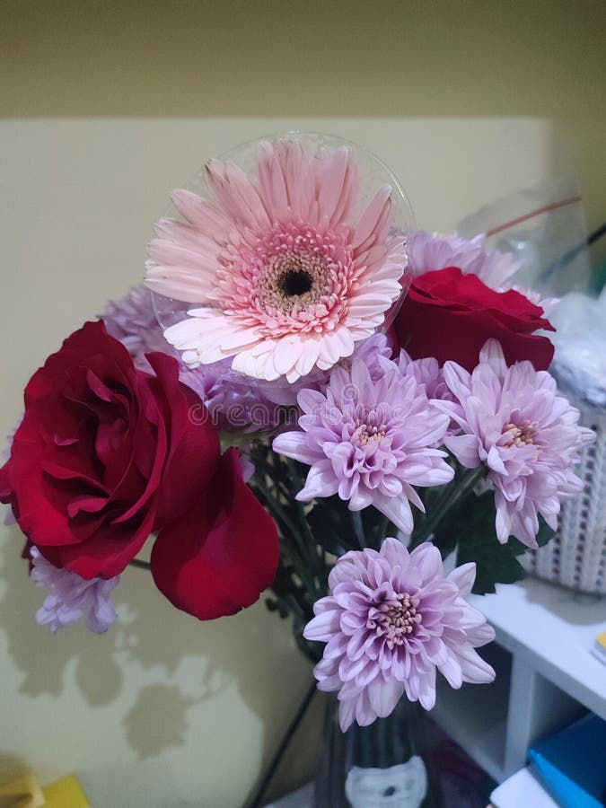 Flowers in a bucket stock photo. Image of asters, roses - 372095512