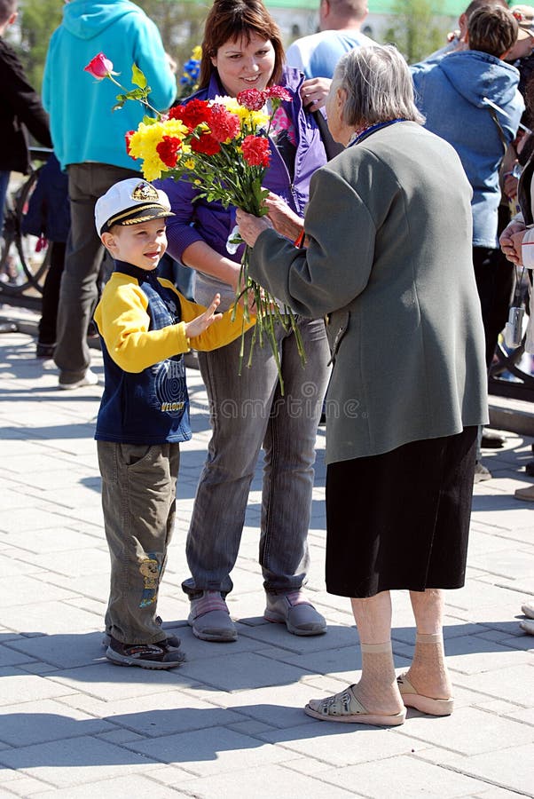 Flowers for a Female Veteran. Victory Day. Editorial Photography ...