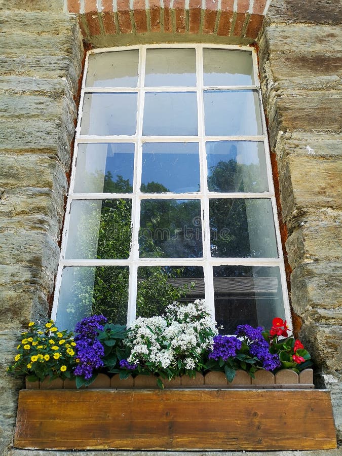 Flowers in Front of an Old House Stock Photo - Image of front, building ...
