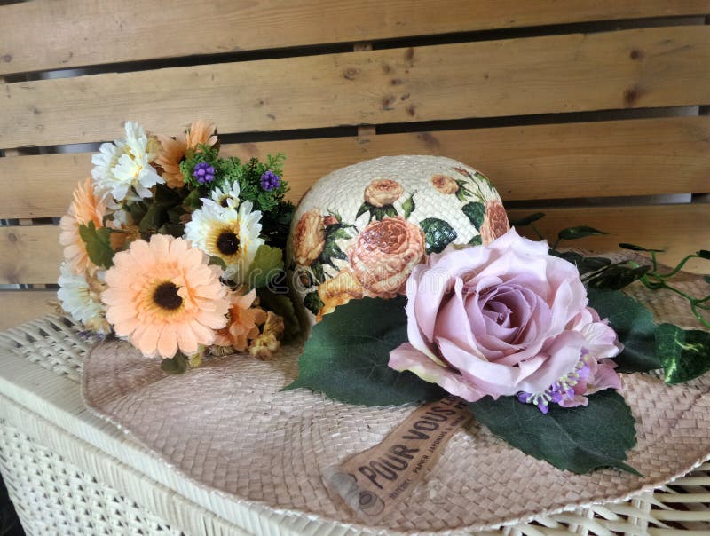 Flowers and hay hat stock photo. Image of passion, flower - 62797016