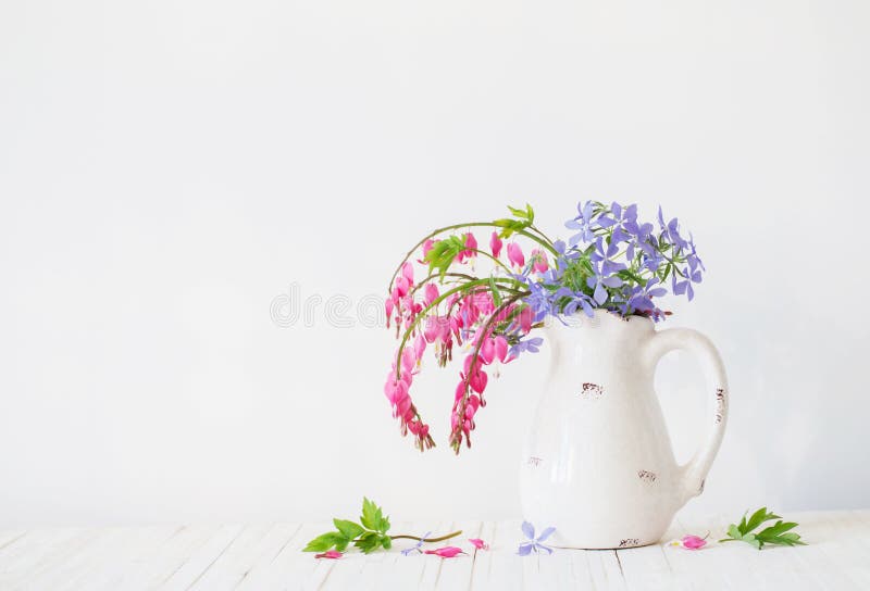 Flowers in jug stock image. Image of multitude, bleeding - 86278593
