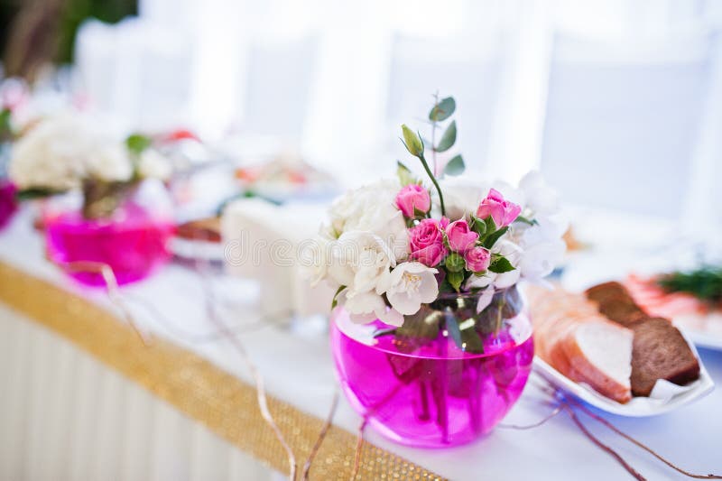 Flowers on Vase with Pink Water at Table of Newlyweds. Stock Image ...