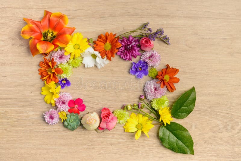 Flowers on wooden table stock image. Image of blossom - 68180229