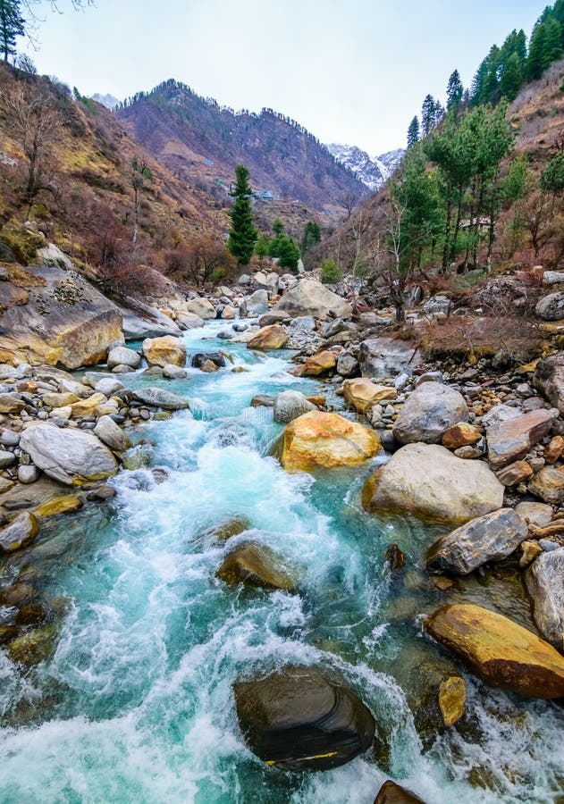 A Flowing River with Rocks on Its Way and by the Sides. Mountain and ...