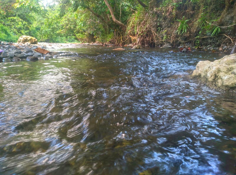 Flowing River Water with the Reflection of Sunlight Stock Image - Image ...