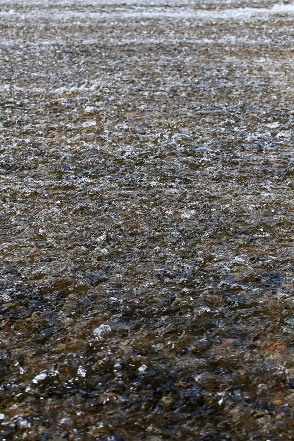 Flowing Shallow Water with Ripples and Rocks Underneath Stock Photo ...
